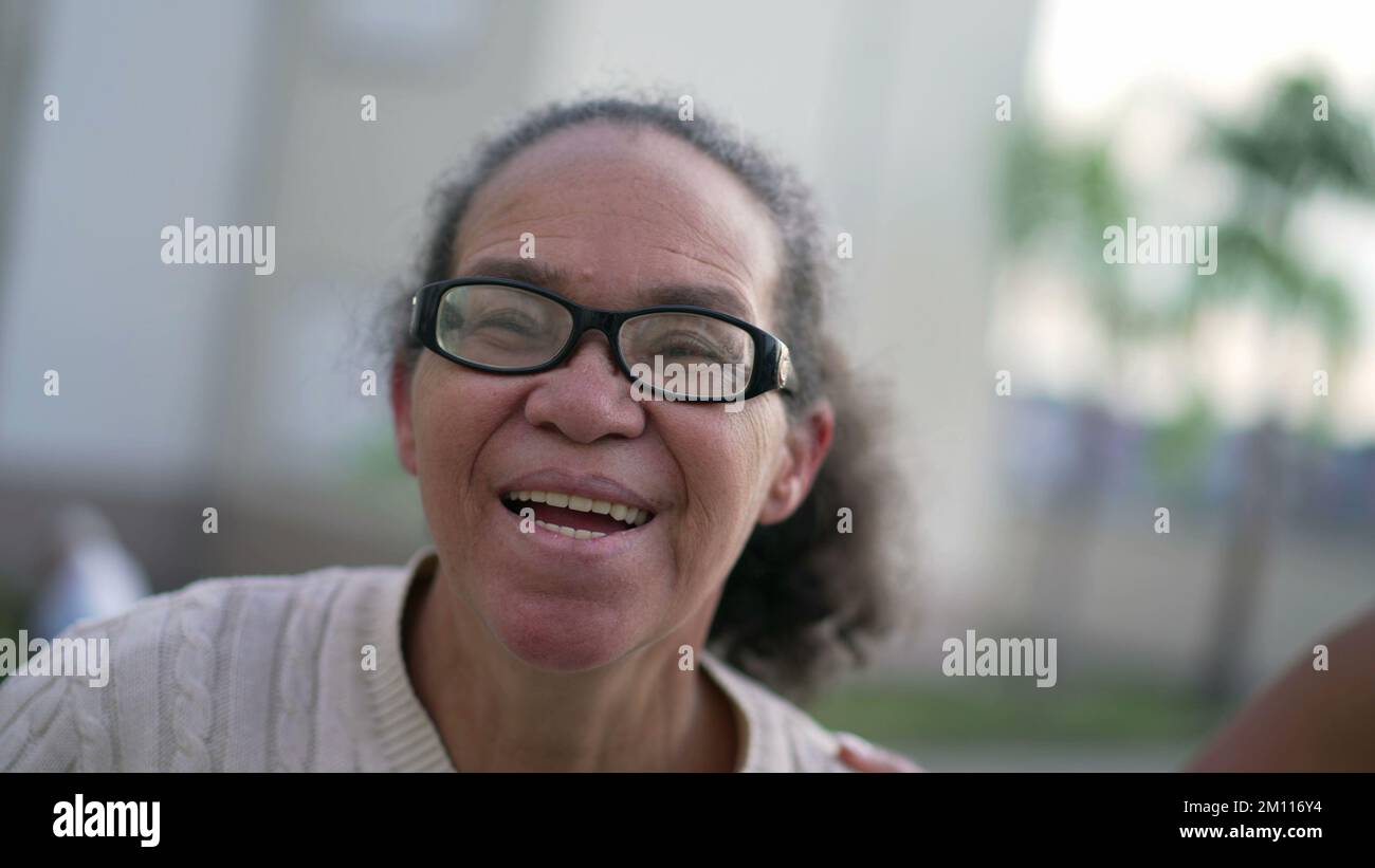 One happy senior woman laughing and smiling. South American hispanic ...