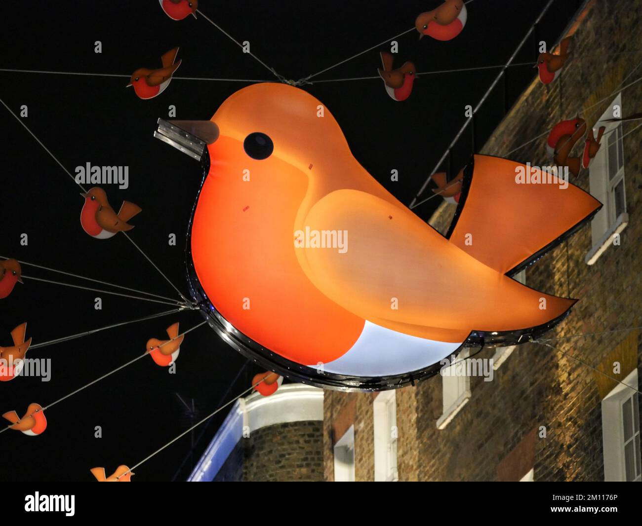 Robin Christmas decorations in Carnaby Street, London Stock Photo - Alamy