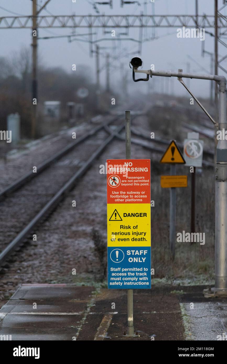 Warning signs at end of platform at Leigh on Sea station, Essex, UK. No ...