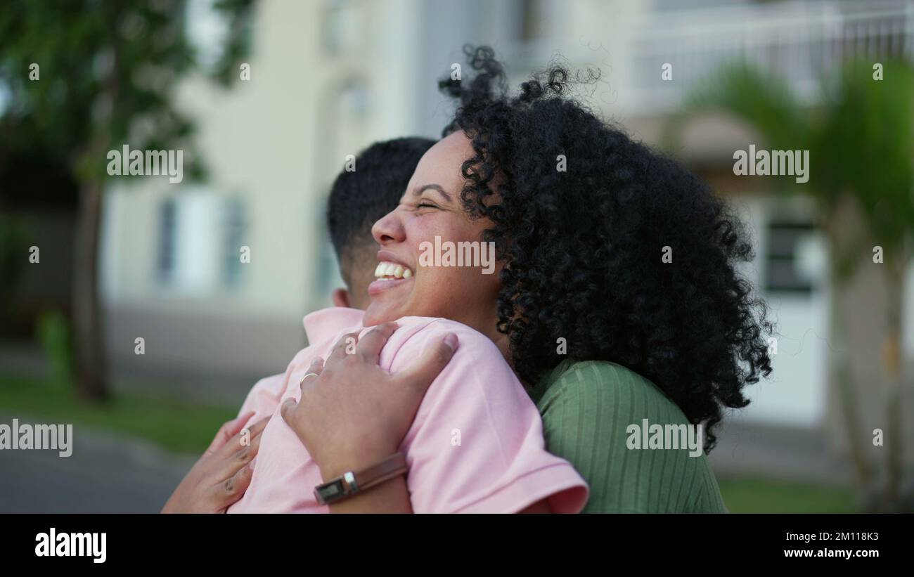 Happy people embrace. Real life authentic family hug. Ecstatic young ...