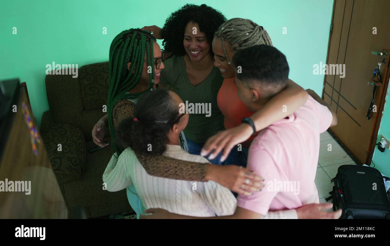 Happy hispanic family hugging each other at home. South American people ...