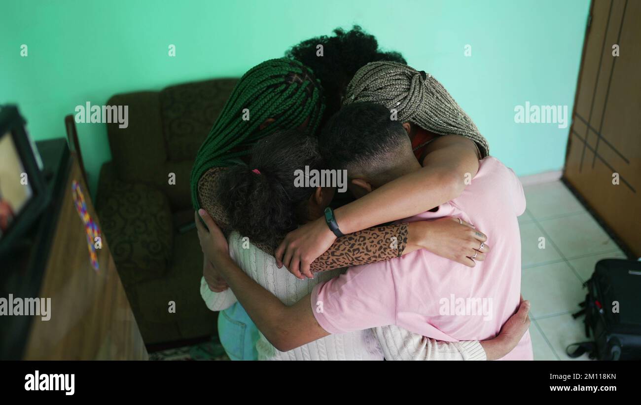 Happy hispanic family hugging each other at home. South American people ...