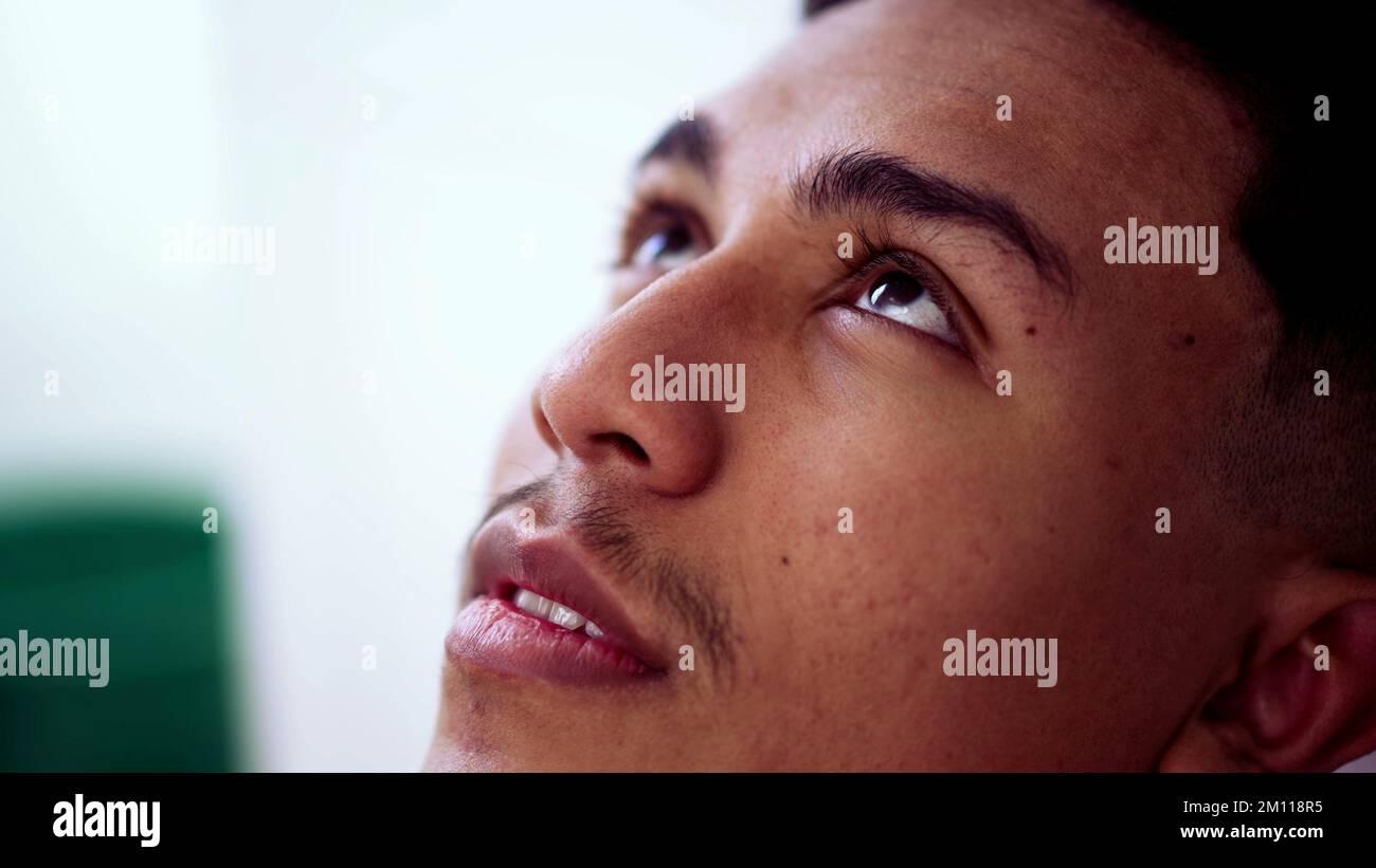 Hispanic young man in meditative contemplation eyes closed. Happy latin ...