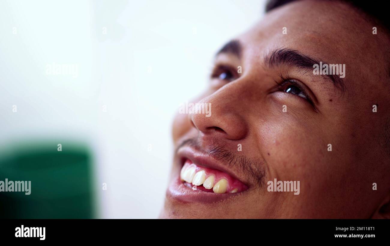 Hispanic young man in meditative contemplation eyes closed. Happy latin ...