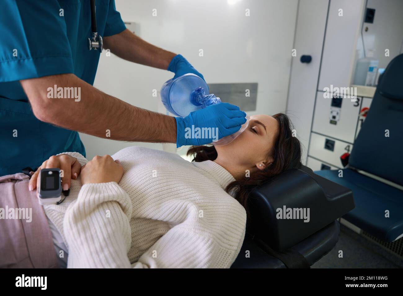 Woman is given emergency medical care and resuscitation in auto Stock ...