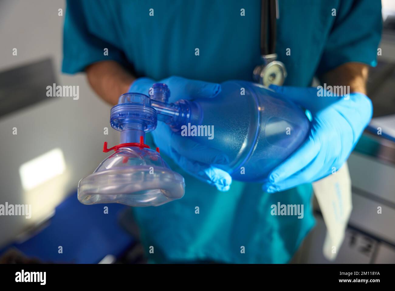 Doctor is preparing a blue oxygen tank for ambulance work Stock Photo ...