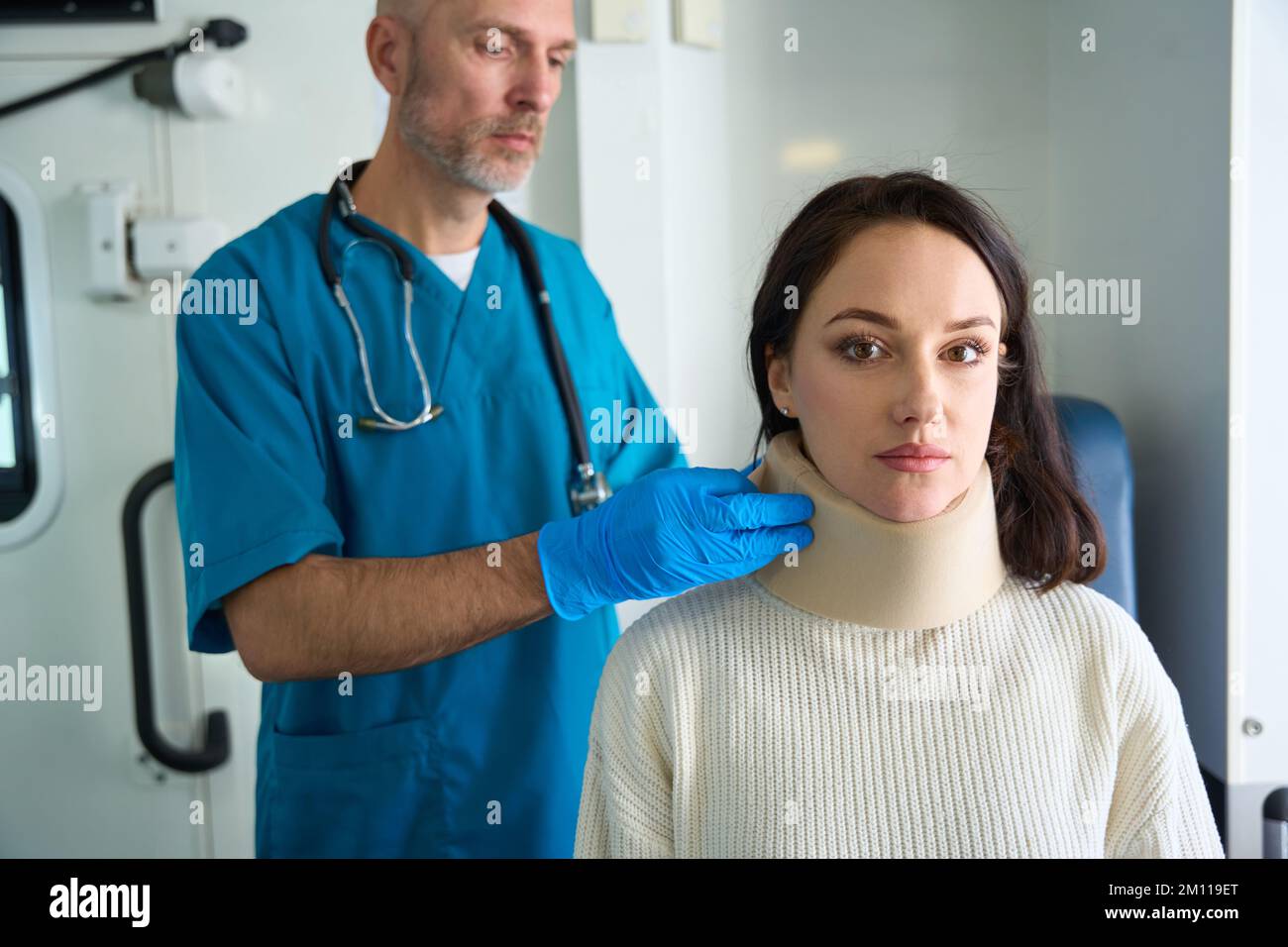 Woman is sitting on a medical procedure to secure brace Stock Photo - Alamy