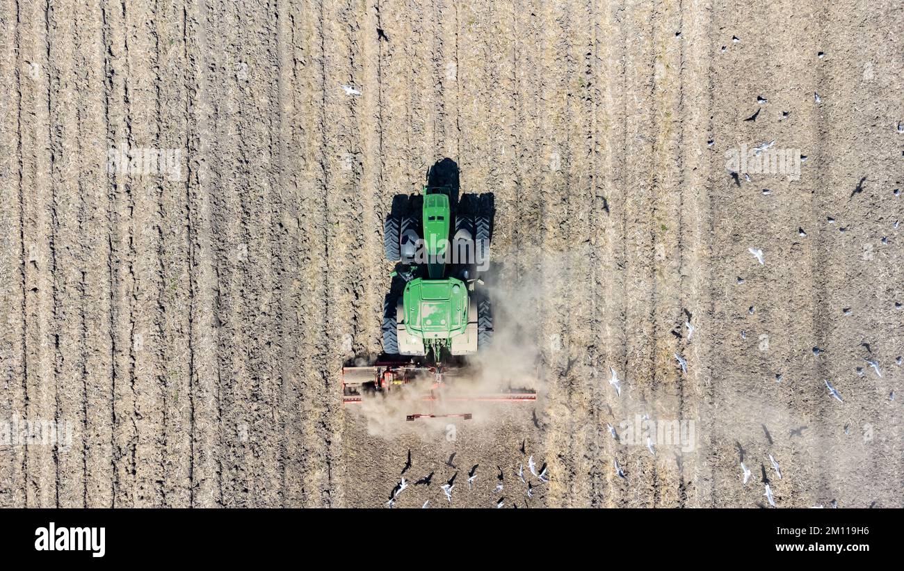 Aerial view tractor cultivating land hi-res stock photography and ...