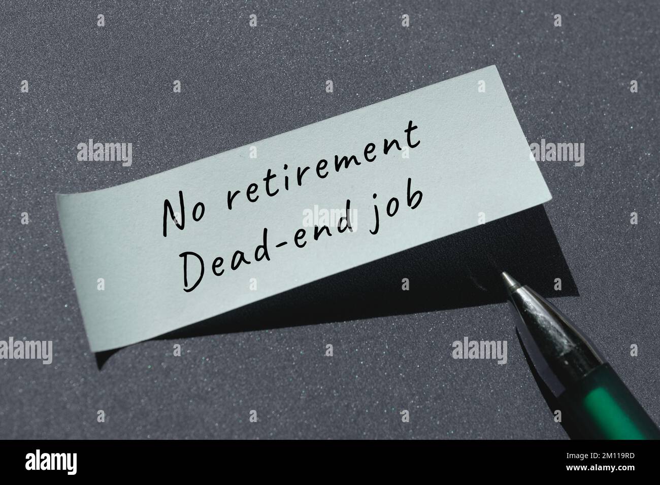 No retirement, dead-end job words written on paper note with pen ...