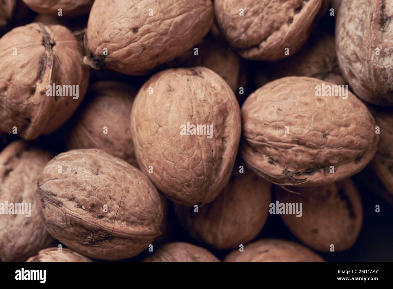 Walnuts with and without shells as background Stock Photo - Alamy