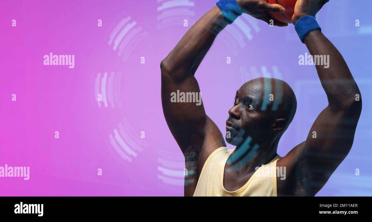 Bald african american basketball player with arms raised throwing ball ...