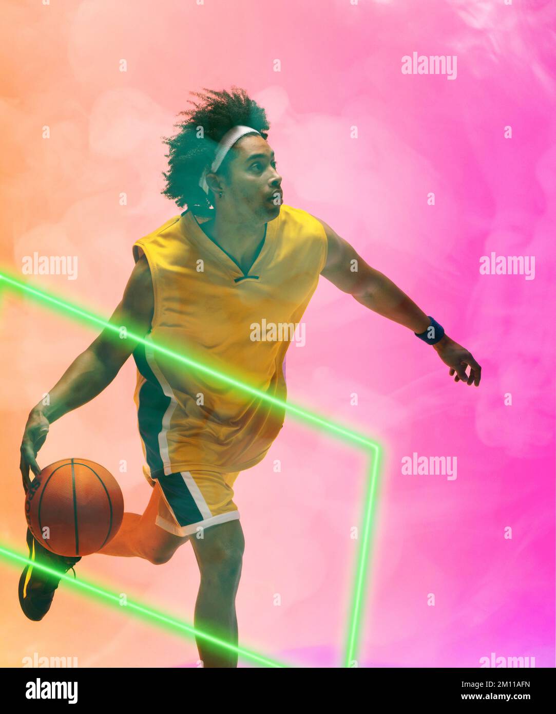 Composite of biracial male player playing basketball by rectangle on ...