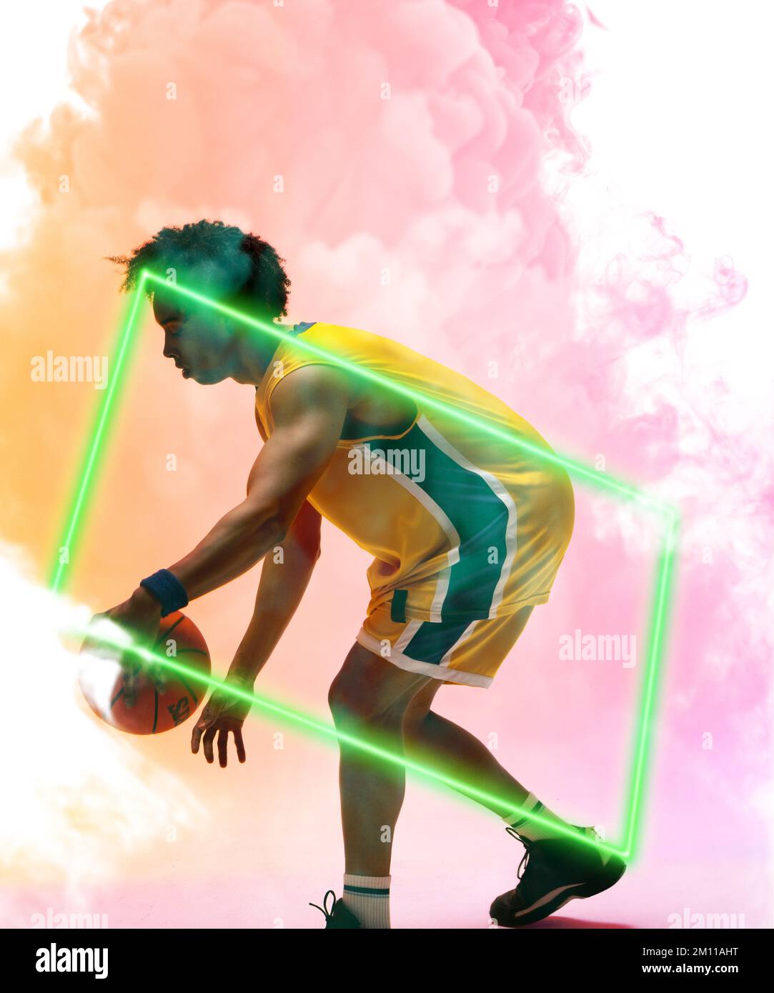Side view of biracial male player dribbling basketball by rectangle ...