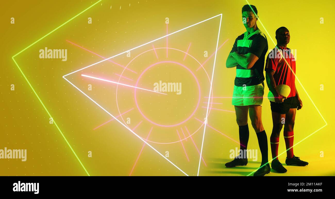 Composite of diverse male rugby players standing by illuminated ...