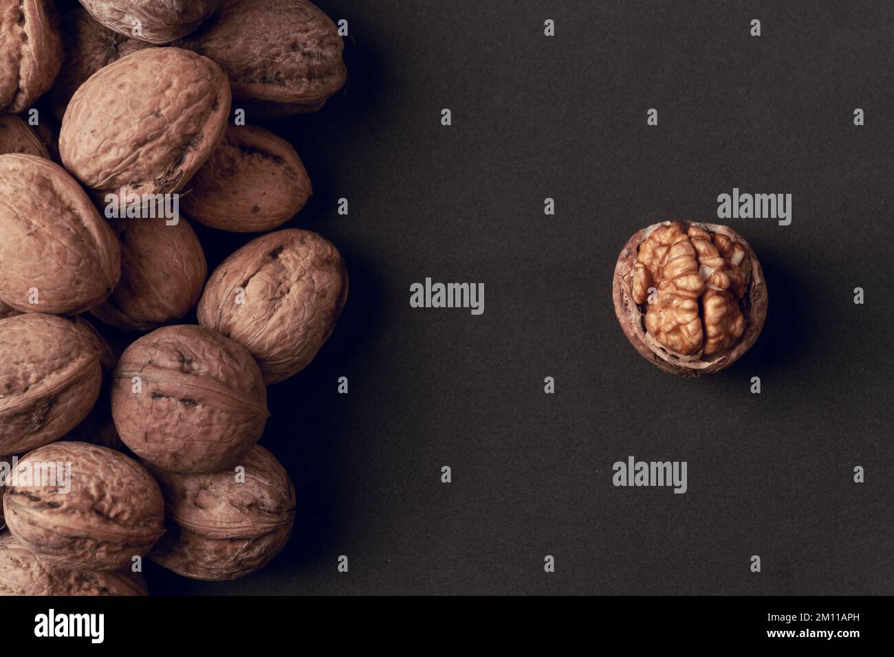 Walnuts with and without shells as background Stock Photo - Alamy