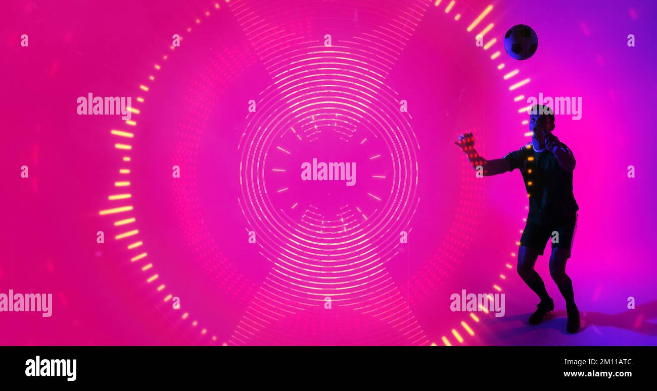 Young soccer player practicing over neon design with pink background ...