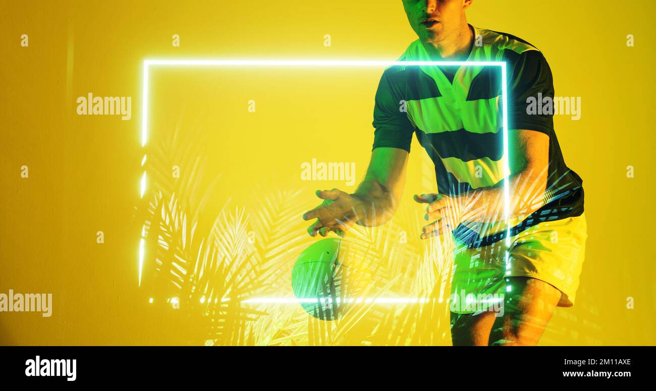 Midsection of caucasian rugby player throwing ball by rectangle and ...