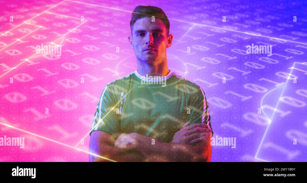 Portrait of confident caucasian sportsman with neon soccer field and ...