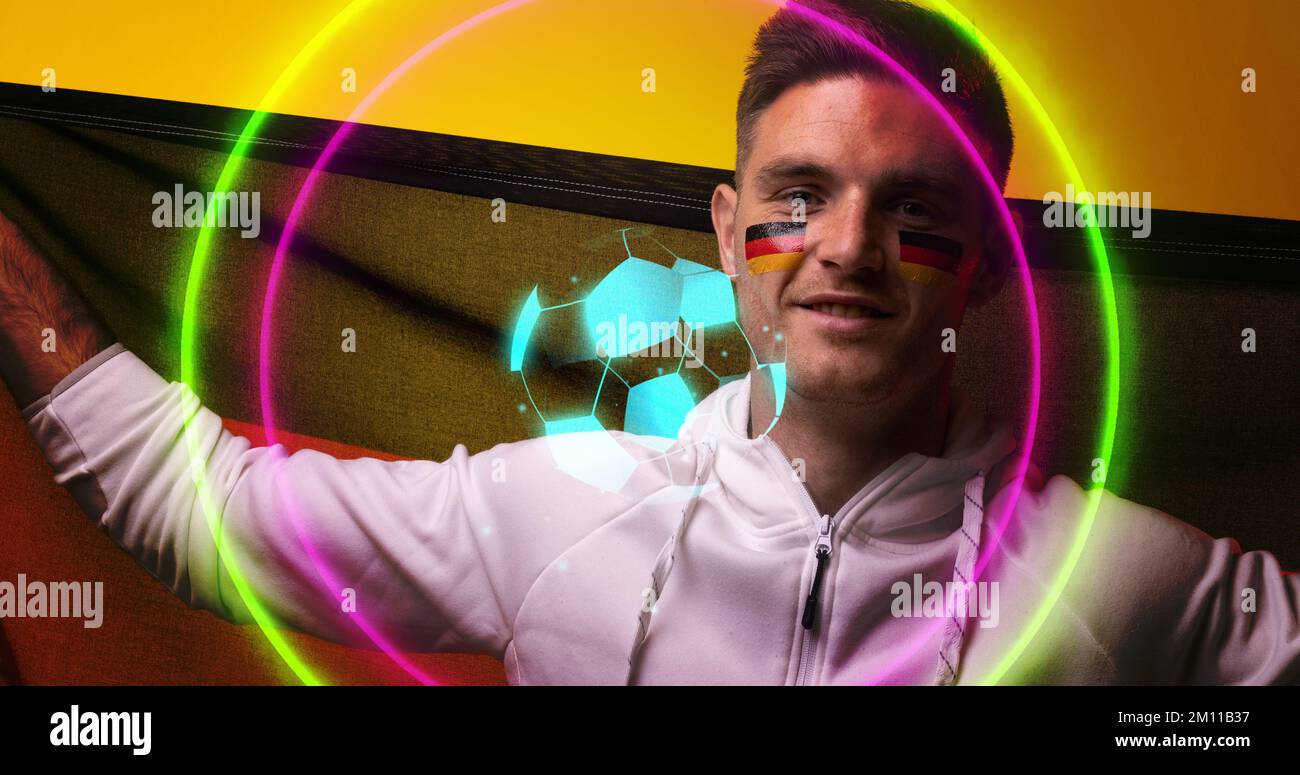 Composite of caucasian soccer player with german flag celebrating ...