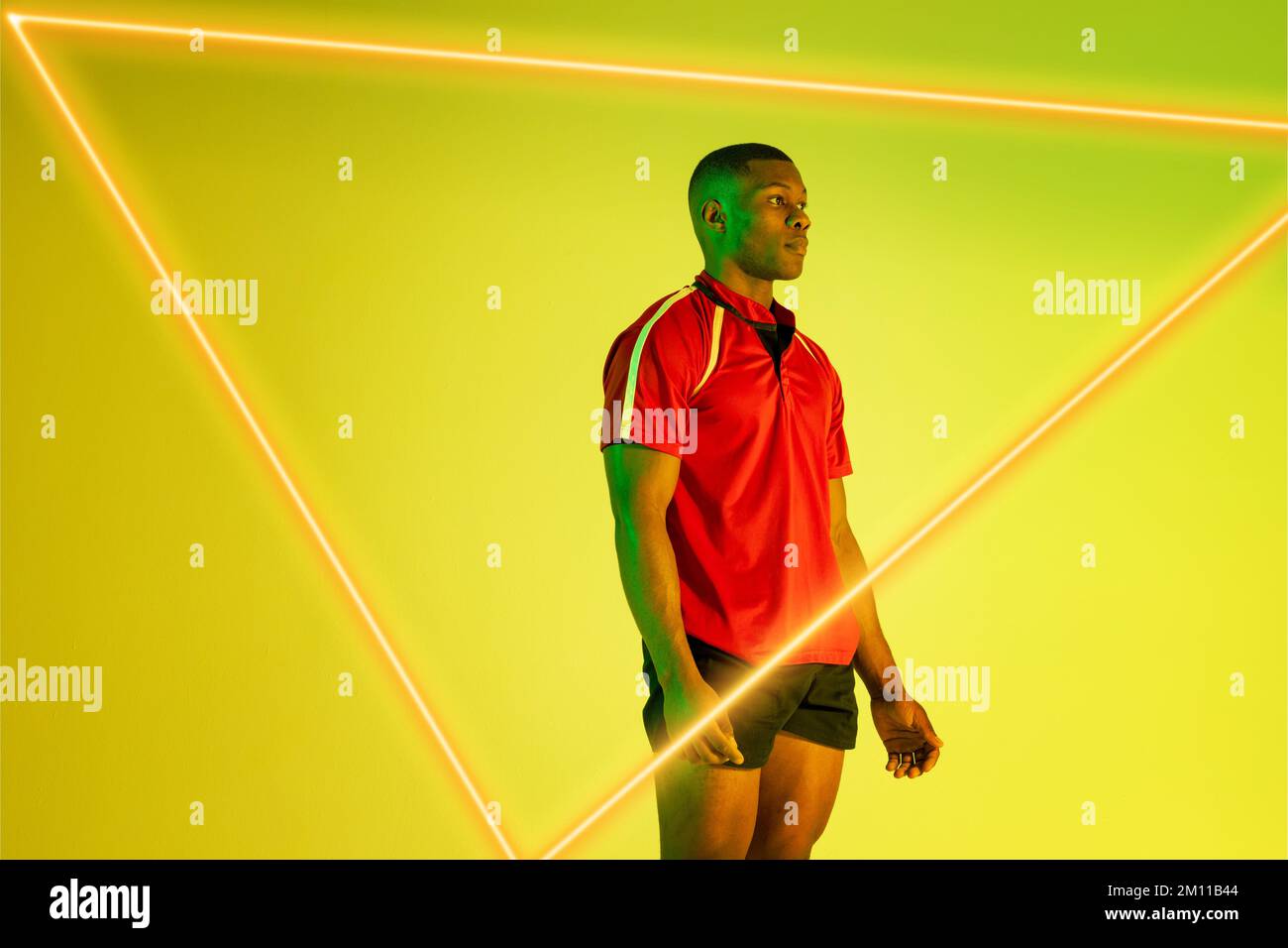 Triangle neon over thoughtful african american young sportsman standing ...