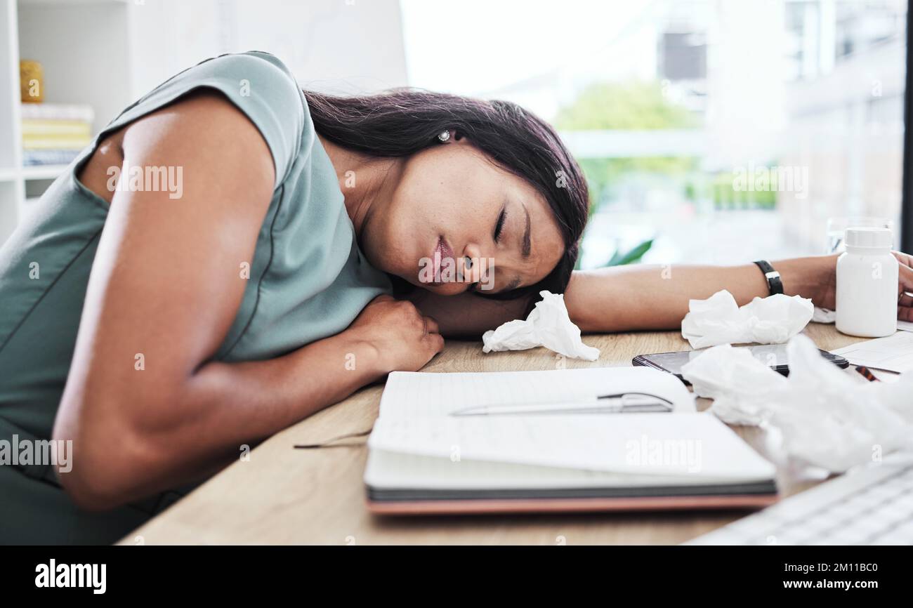 Woman, sick and sleeping on office desk in burnout suffering from ...