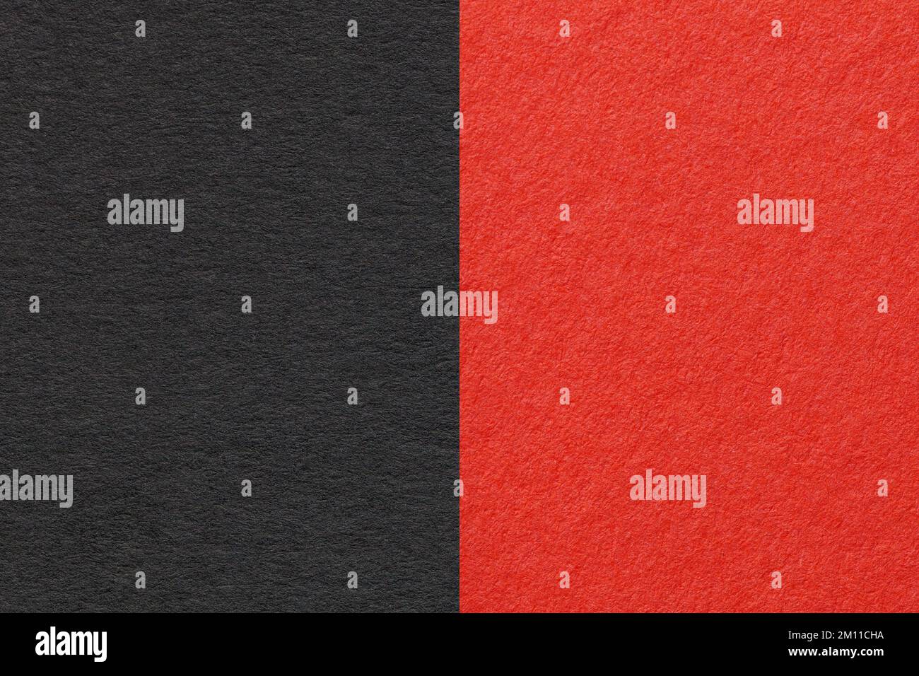 Texture of craft black and bright red paper background, half two colors ...