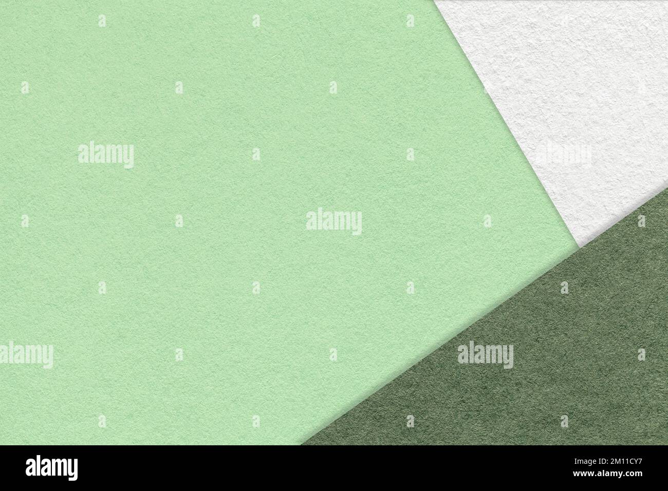 Texture of craft light green color paper background with white and ...