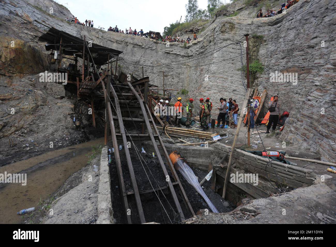 Jakarta, Indonesia. 9th Dec, 2022. Rescuers work at a coal mine after ...