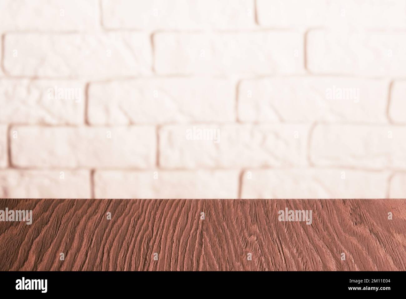 Wooden table display template with white brick walls on the back ...