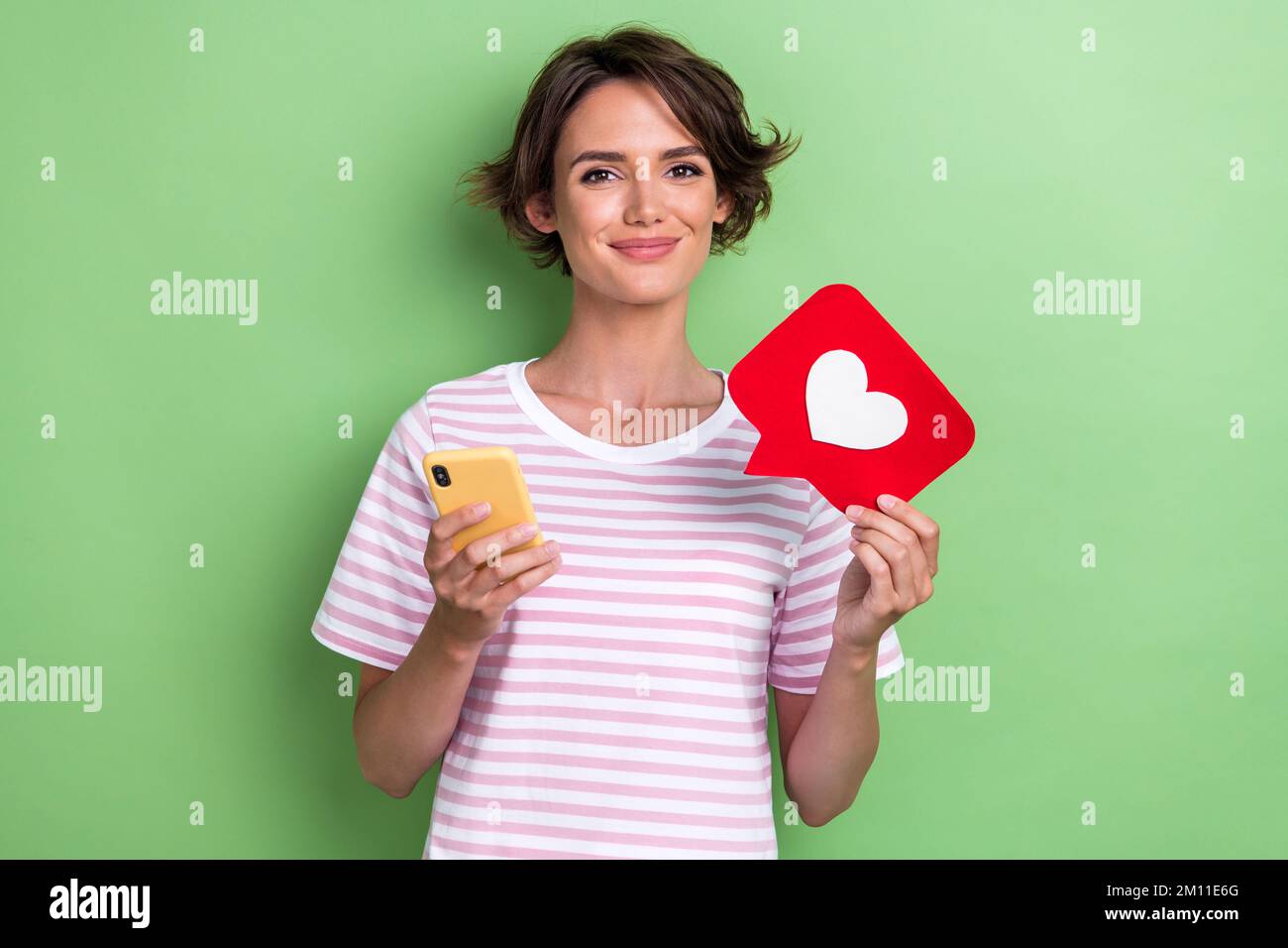 Photo of charming positive lady trendy outfit arm hold telephone red ...