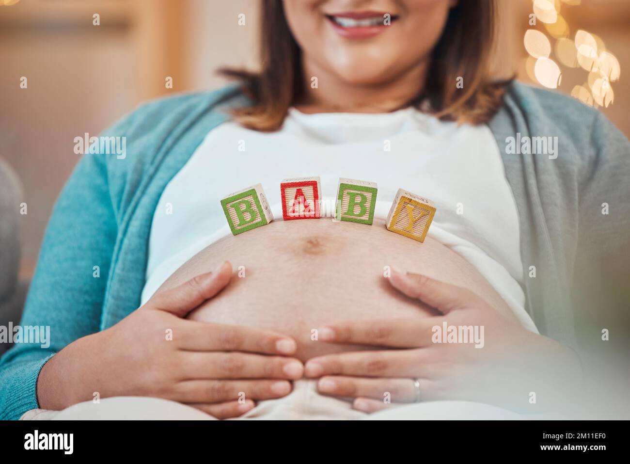 Pregnant woman, hands and baby letter blocks for maternity, love and ...