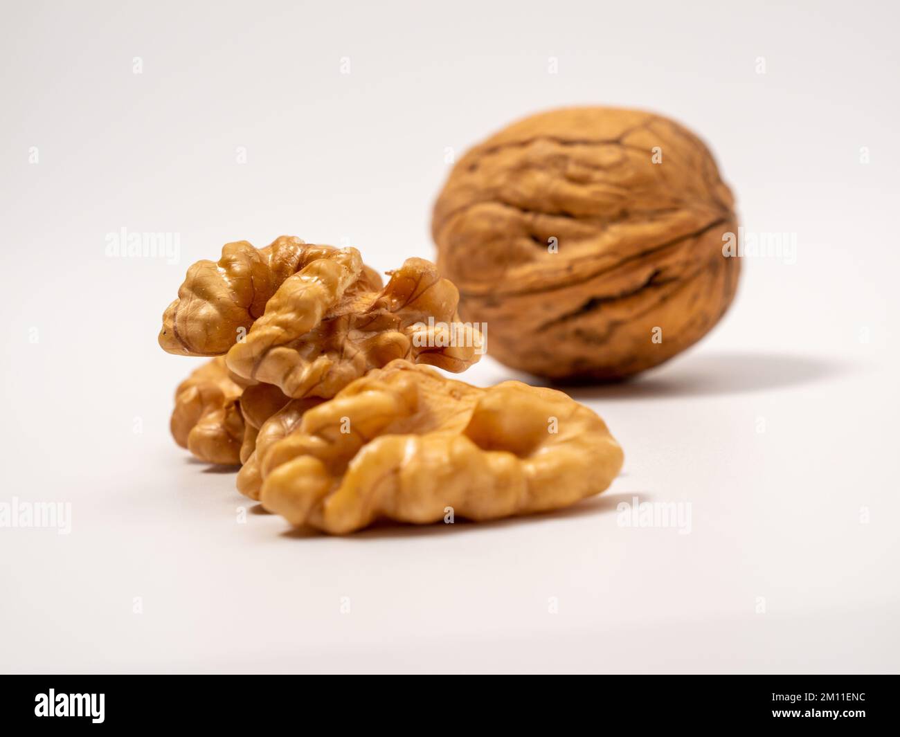 Walnut on a white background. Raw walnut. Close-up Stock Photo - Alamy