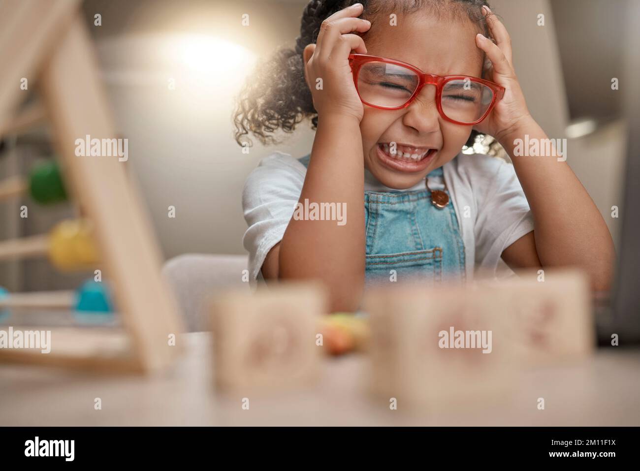 Student, frustrated and learning with education and headache, young ...