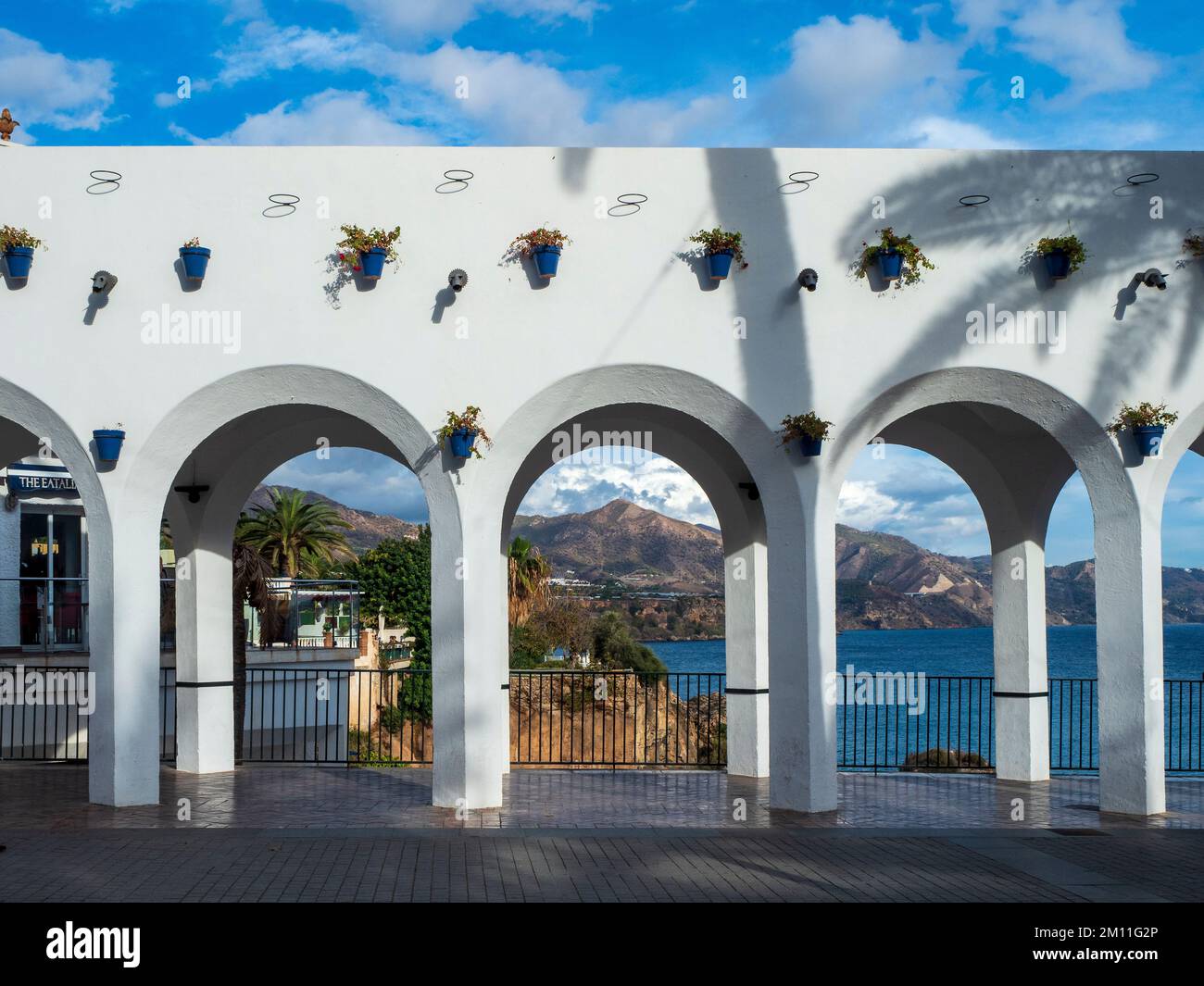 Arches with flowerpots on the Balcón de Europa in Nerja Stock Photo - Alamy