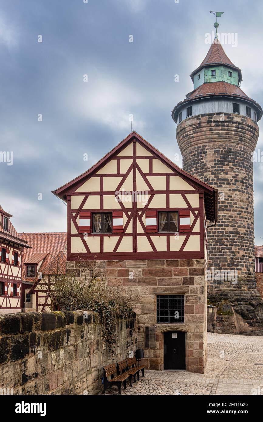 Half-timbered building in the Imperial Castle yard and the Sinwell ...