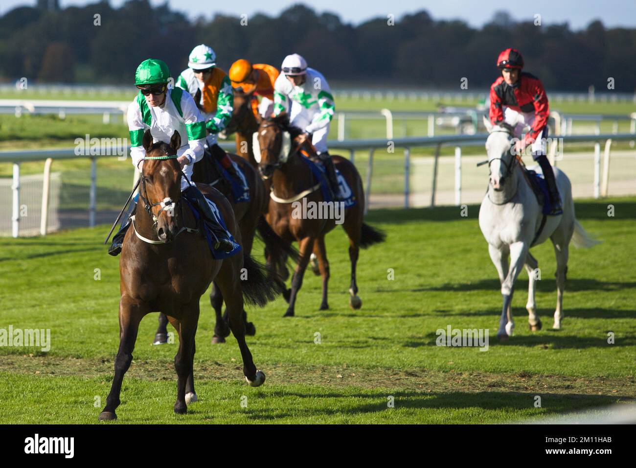 Jockey Sam James rides Exalted Angel at the front of a group of jockeys ...