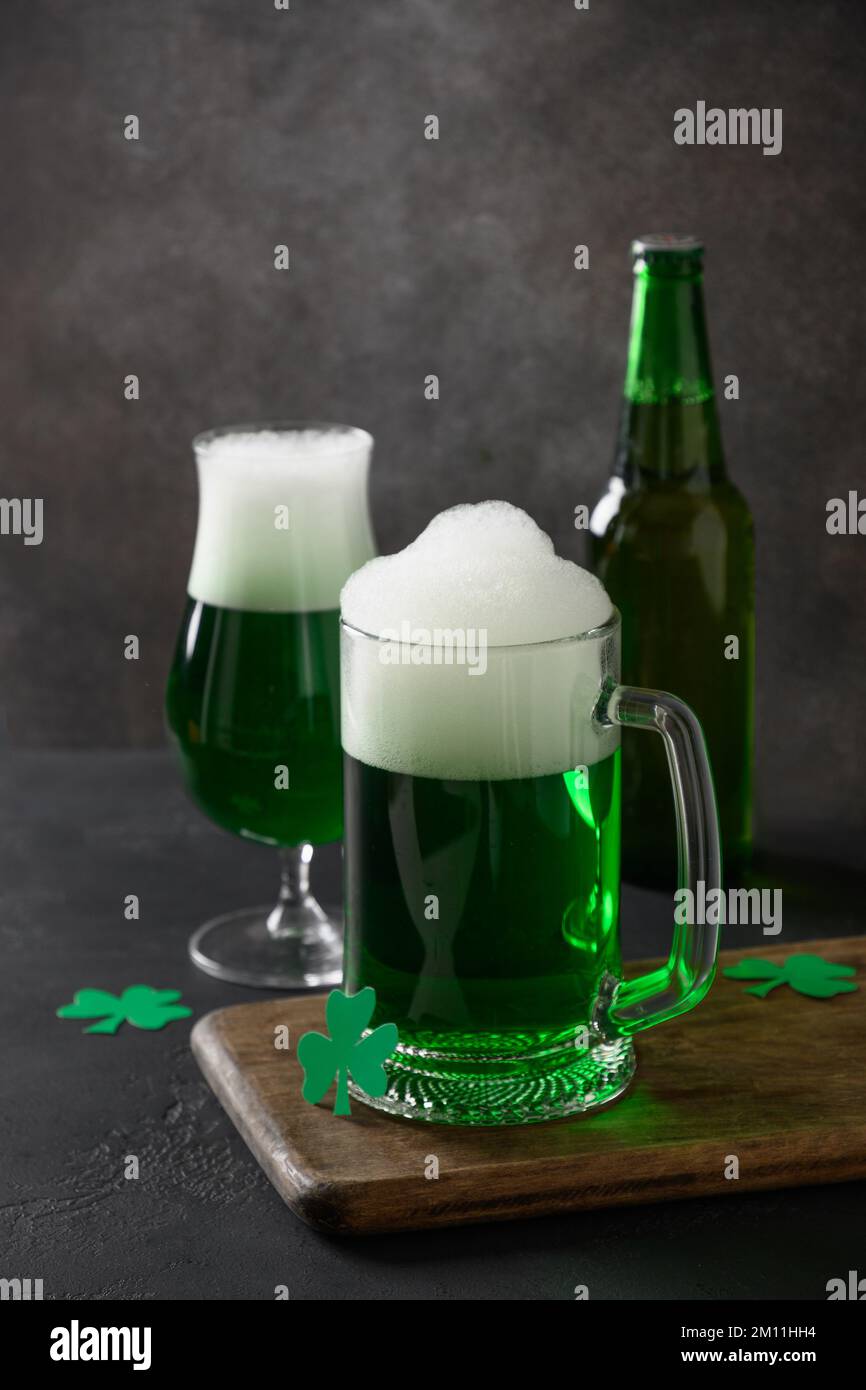 Patrick's day traditional green beer and bottle on dark background ...