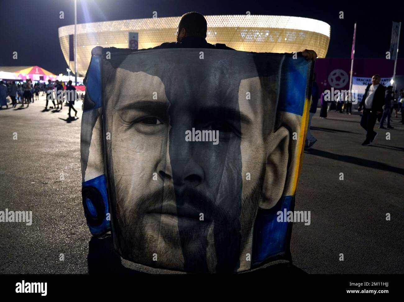 An Argentina flag is draped with a Lionel Messi flag ahead of the FIFA ...