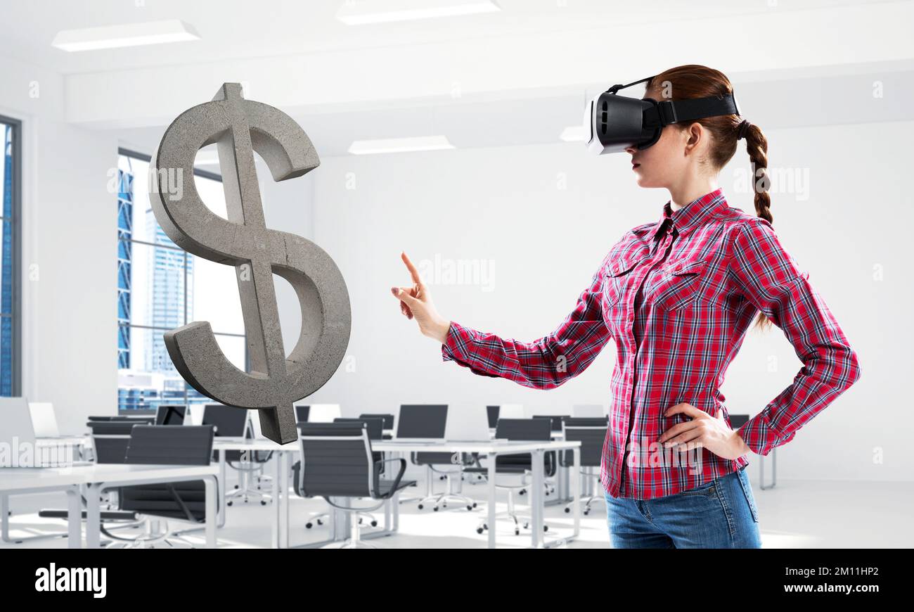 Girl in virtual reality mask experiencing virtual technology world ...