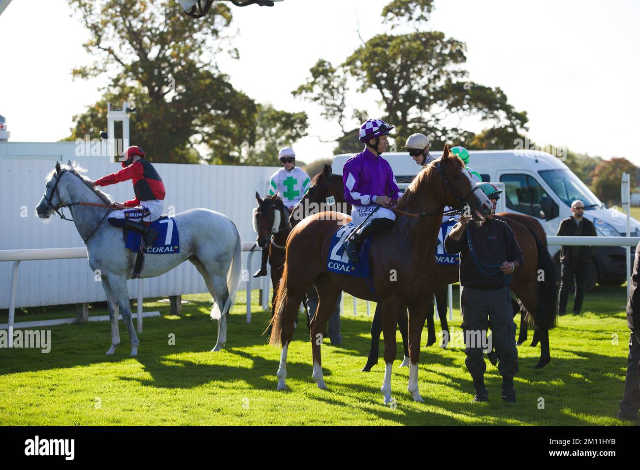 Jockeys waiting to go into the starting gates at York Races including ...