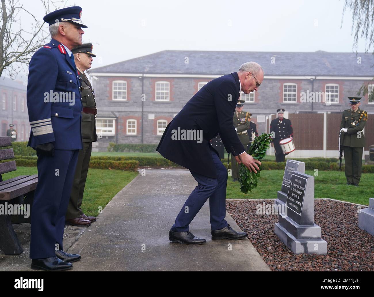 Defence Minister Simon Coveney (right) accompanied by Lieutenant ...