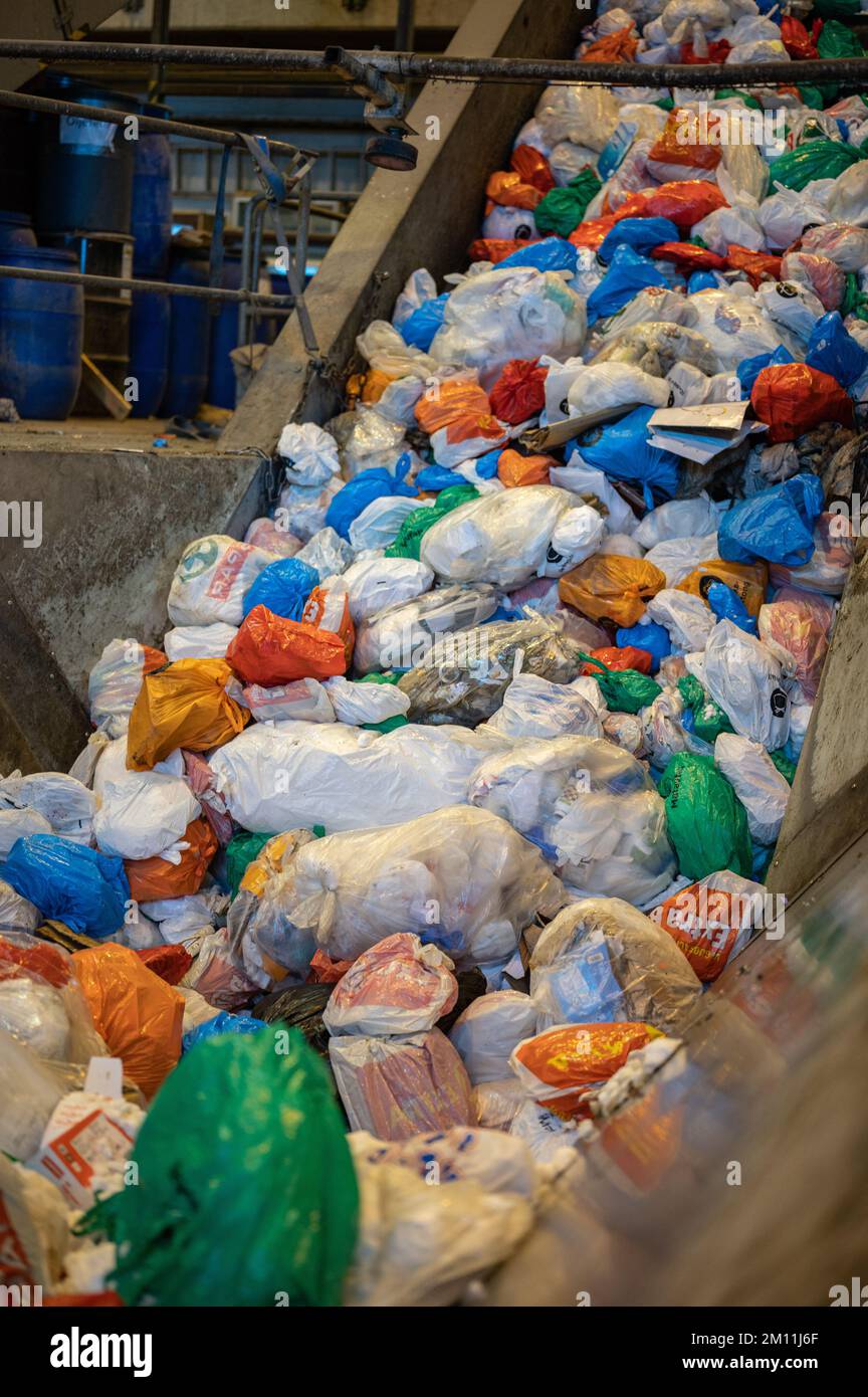 A vertical shot of a bag of waste in recycling process Stock Photo - Alamy