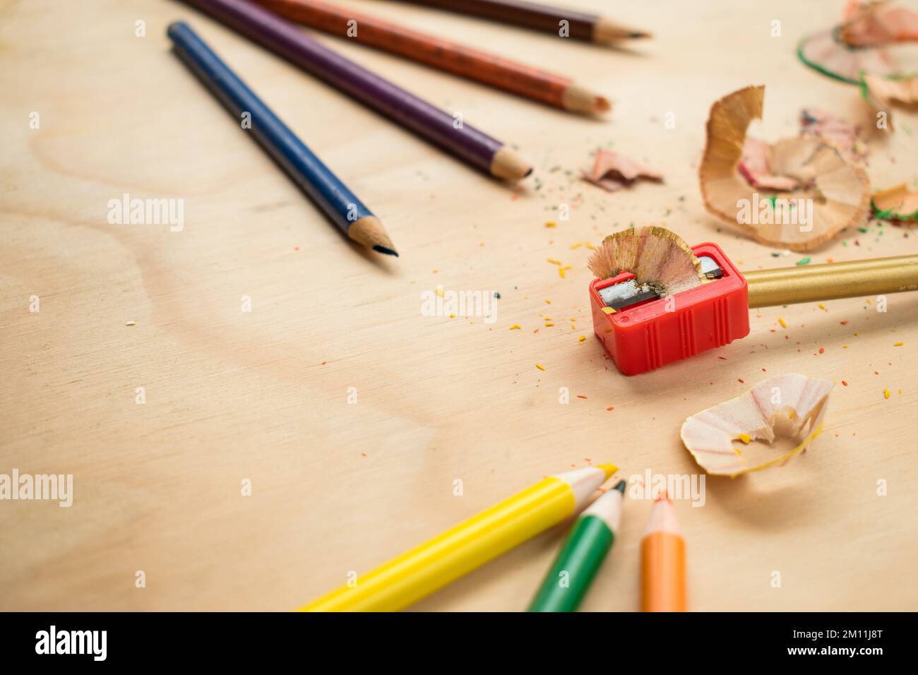 A beautiful colorful background of watercolor pencils spread on a ...