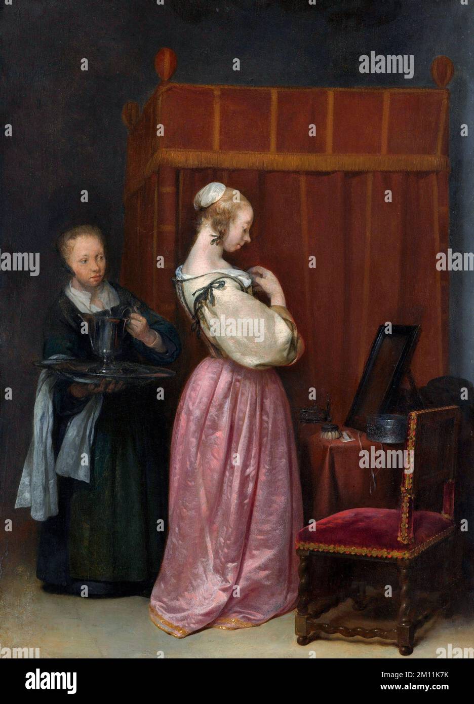 A young woman at her toilet with a maid hi-res stock photography and ...