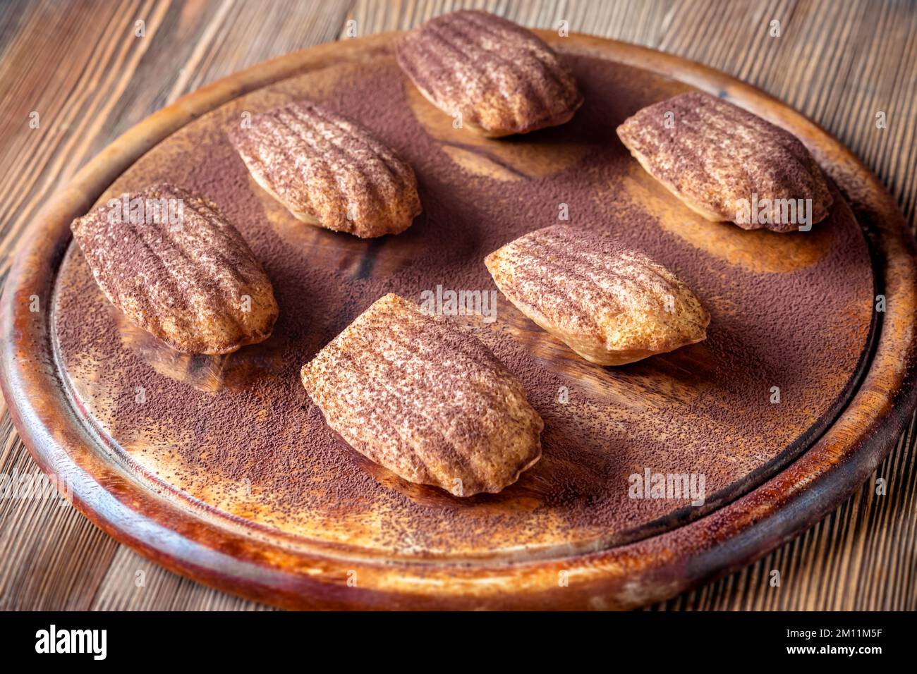 Madeleines - French small sponge cakes with cocoa powder Stock Photo ...