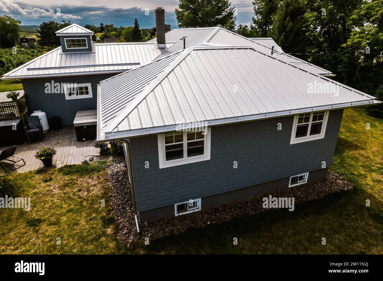 An aerial shot of a house in a rural area on a sunny day Stock Photo ...