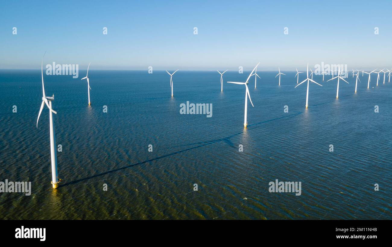 Aerial view at Windmill park with wind mill turbines generating ...