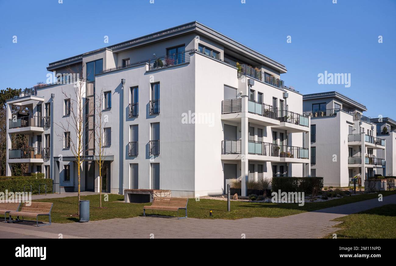 Modern housing complexes in spring daytime in a city. Real estate in ...