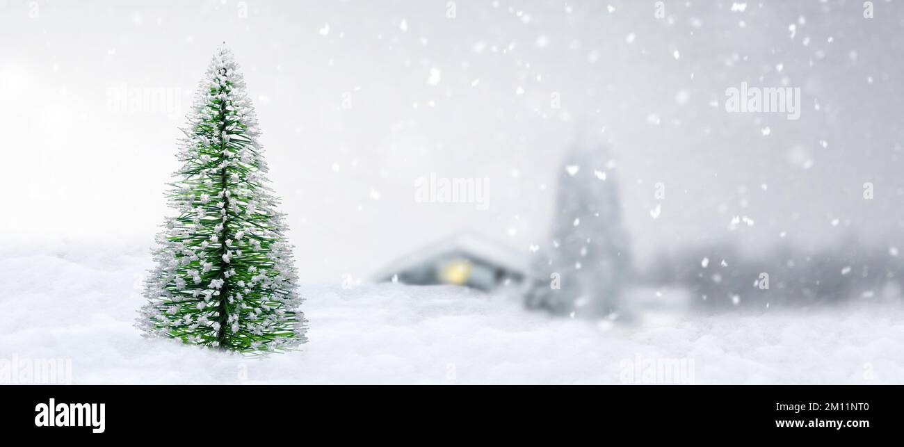 Christmas tree in snow landscape during snowfall Stock Photo - Alamy