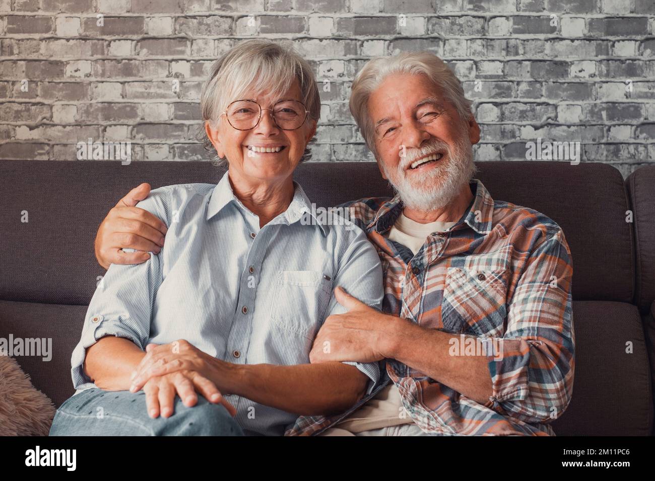 Cute and beautiful couple of old people smiling and looking at the ...